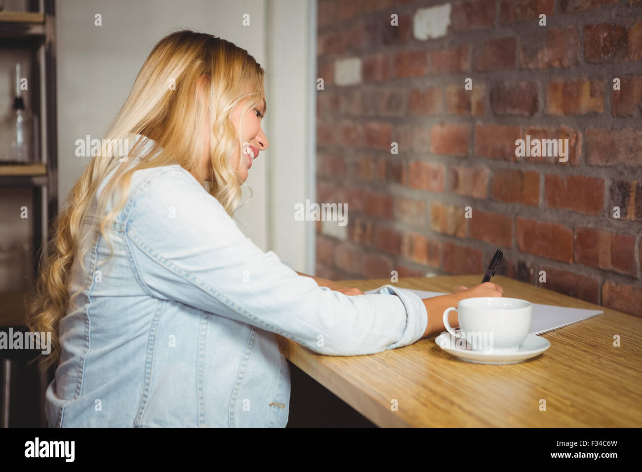Woman and cup of tea and pen and paper hi-res stock photography and ...