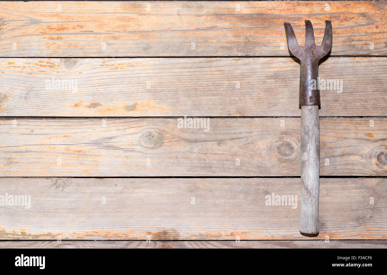 Wooden texture background with rake Stock Photo - Alamy