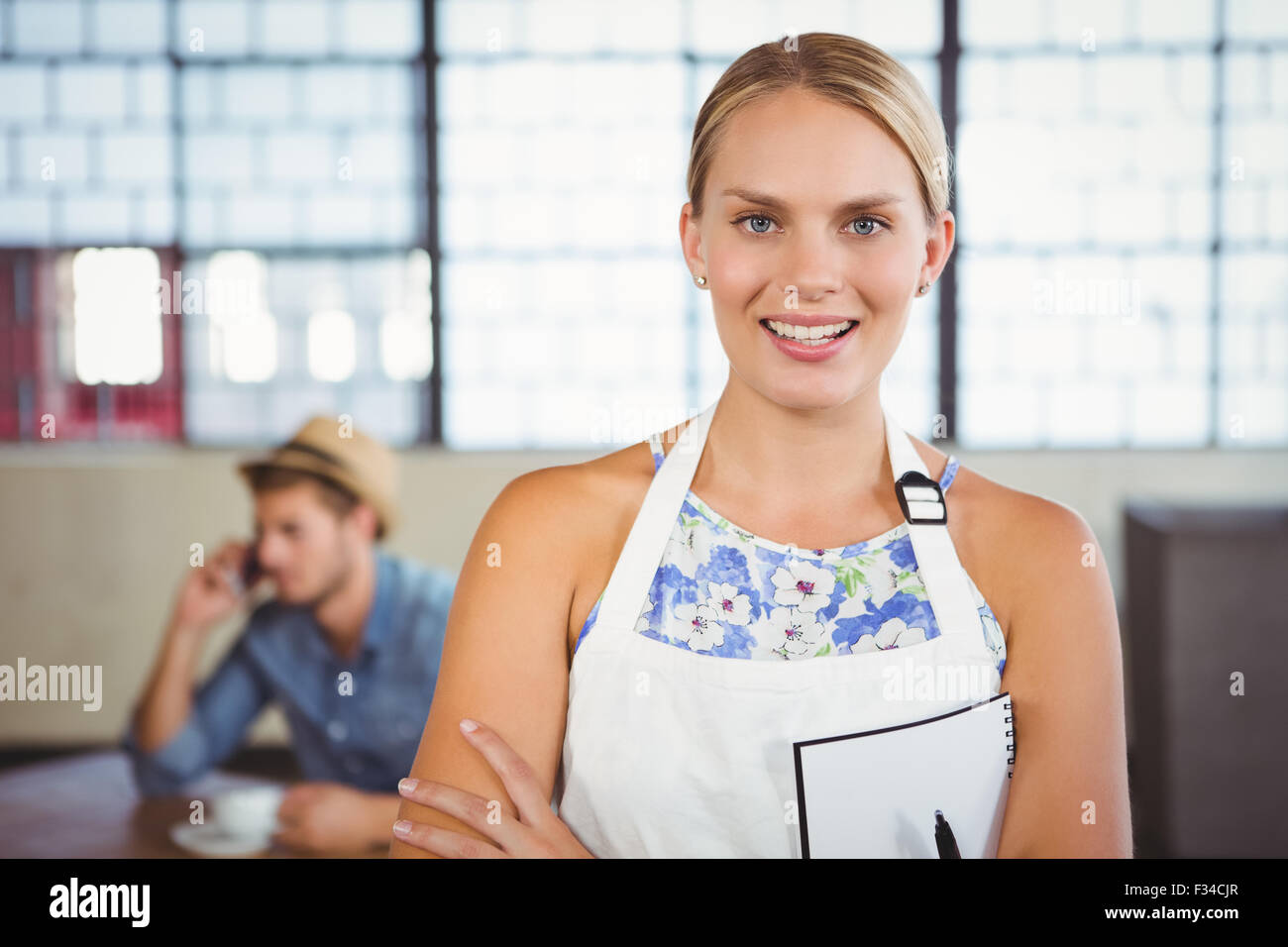 Portrait of a beautiful waitress taking an order Stock Photo - Alamy