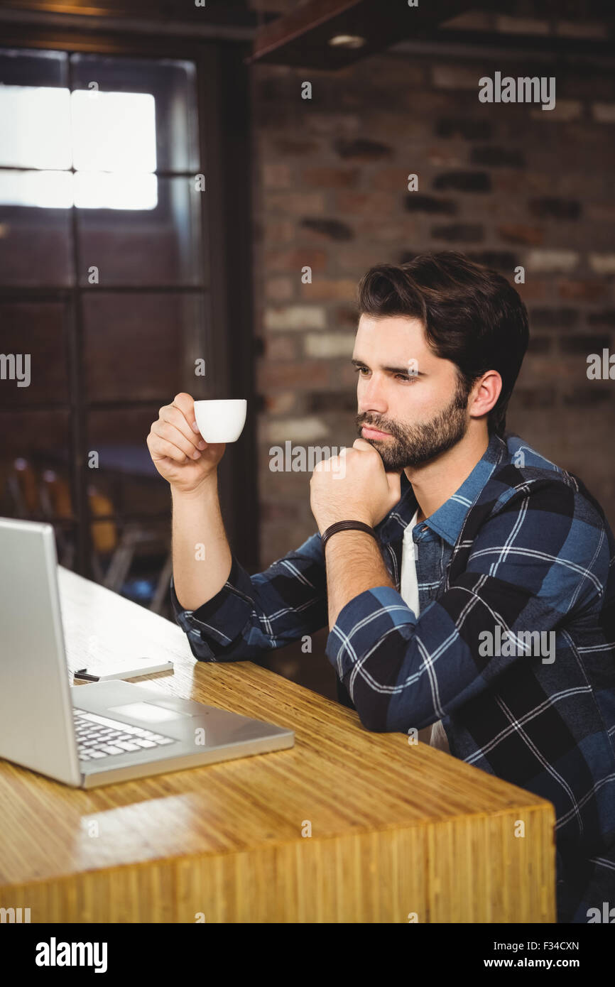 Young student using his laptop Stock Photo - Alamy