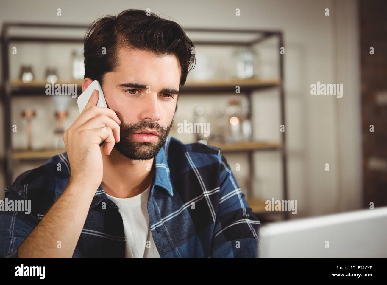 Young student calling a client Stock Photo - Alamy