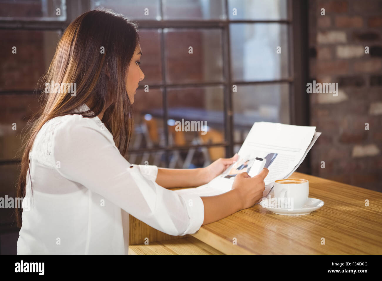 Casual businesswoman looking at files Stock Photo - Alamy