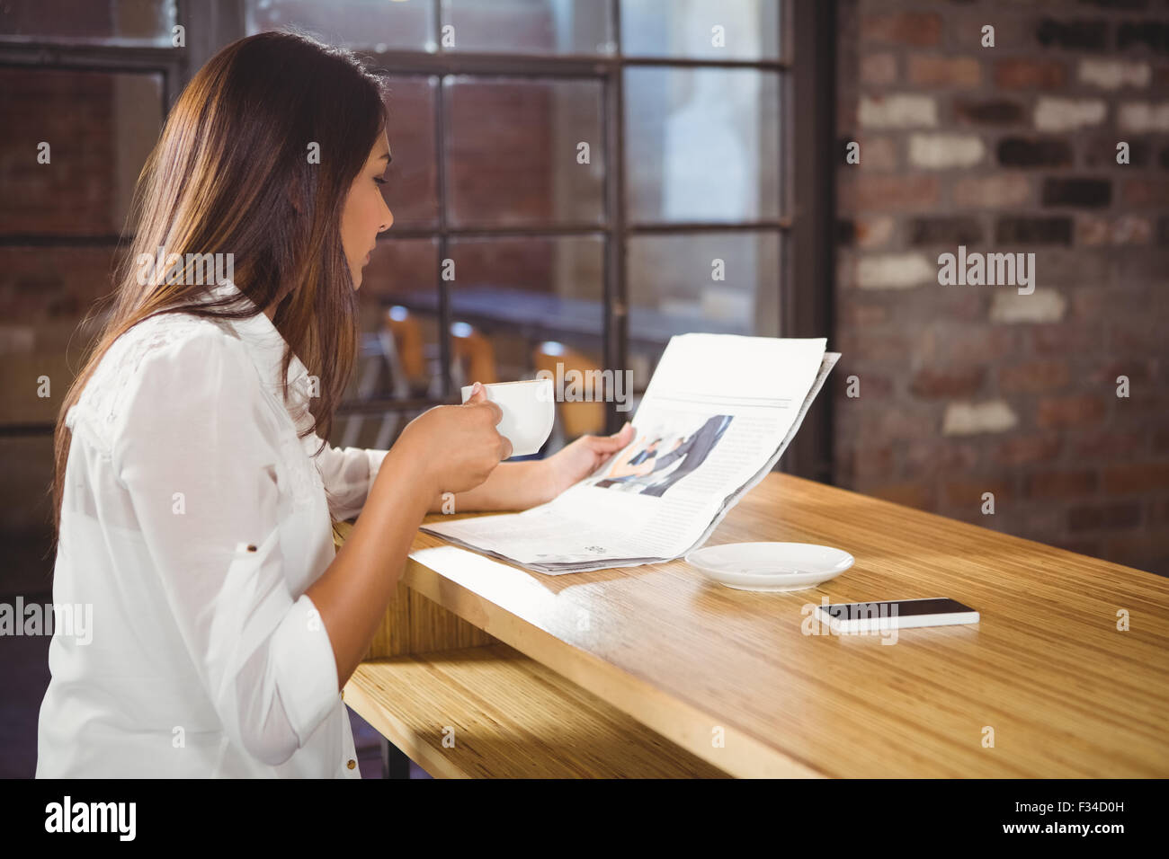 Casual businesswoman looking at files Stock Photo - Alamy
