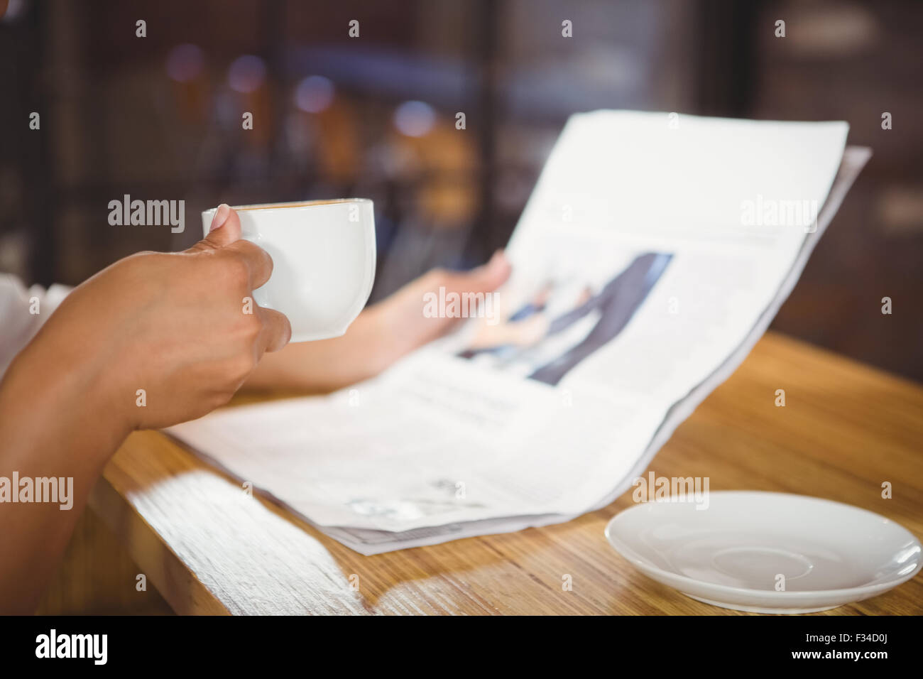 Casual businesswoman looking at files Stock Photo - Alamy