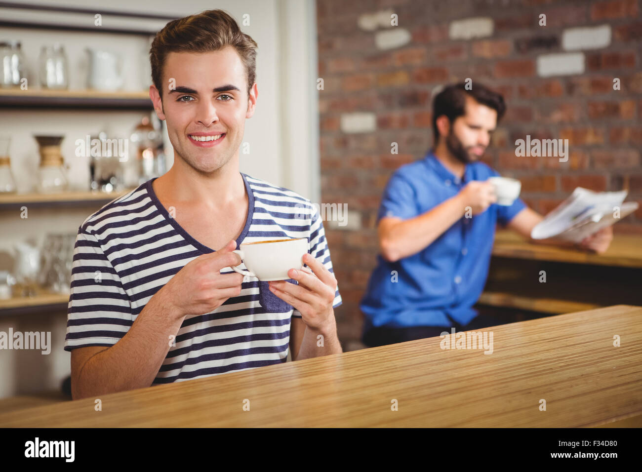 Happy man drinking a coffee Stock Photo - Alamy