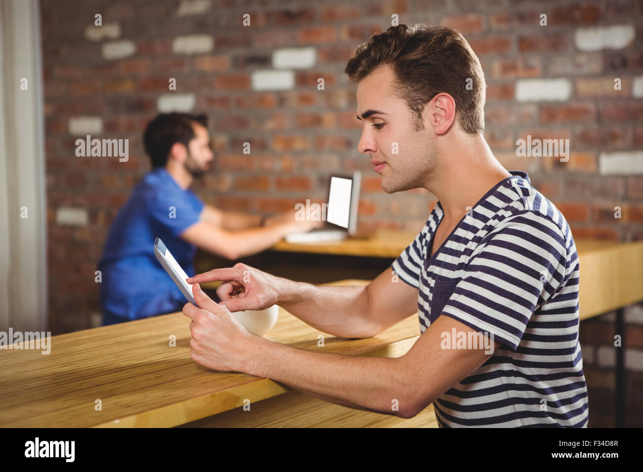 Young student using tablet hi-res stock photography and images - Alamy