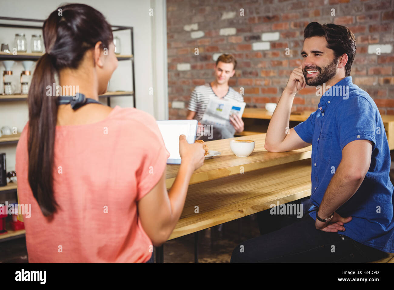 Waitress taking order with a tablet Stock Photo - Alamy