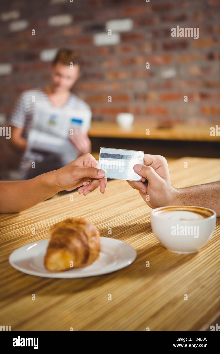 Man paying with his credit card Stock Photo - Alamy