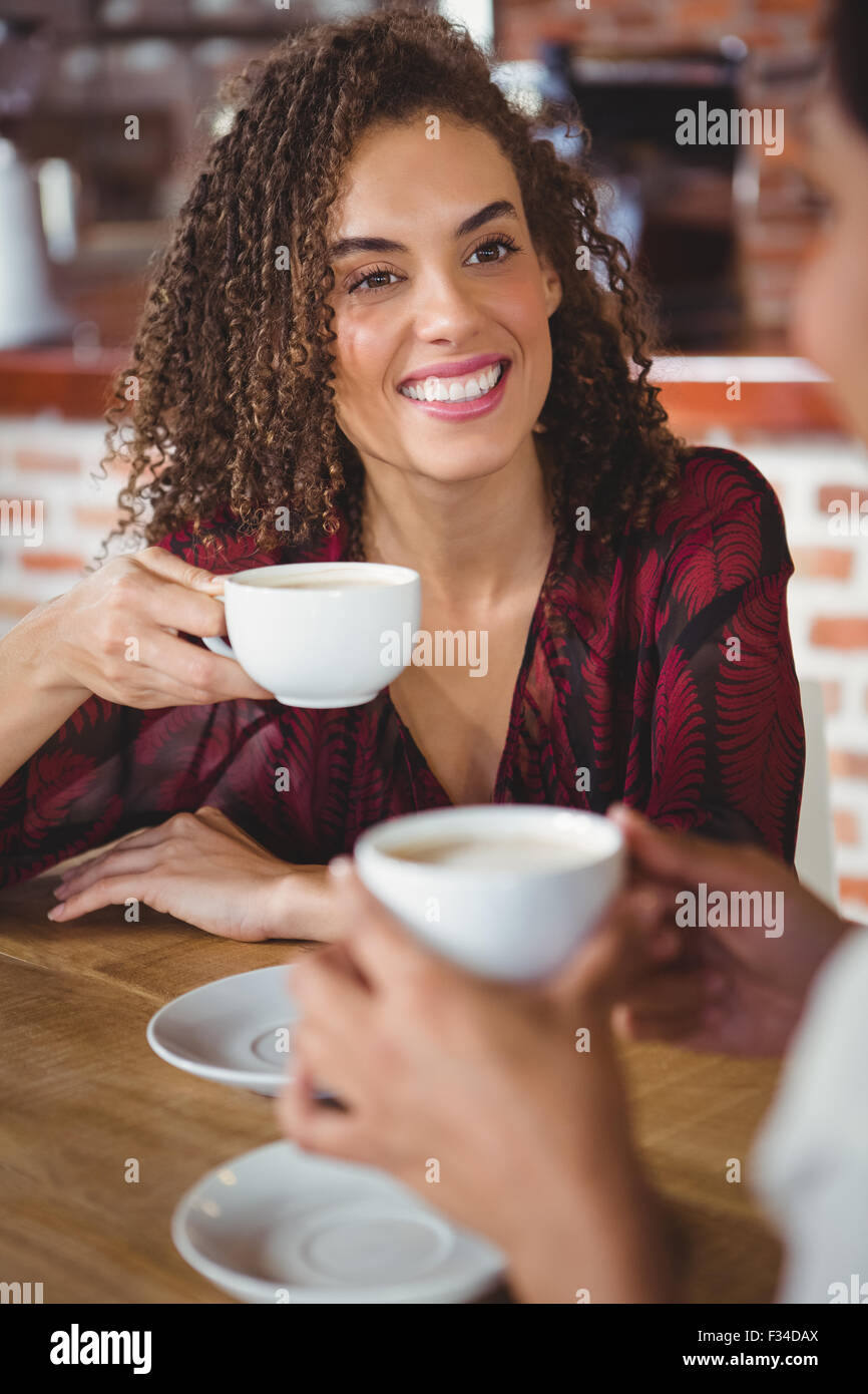 Female friends having coffee Stock Photo - Alamy
