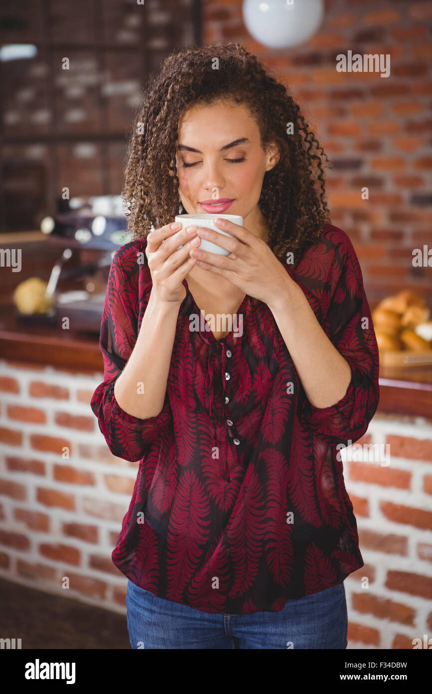 Pretty hipster drinking coffee Stock Photo - Alamy