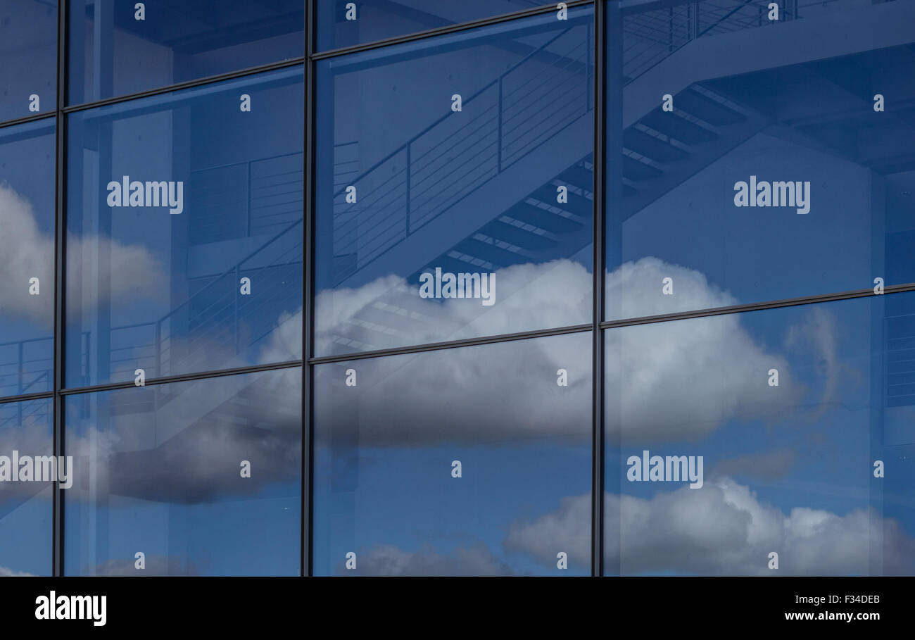 blue sky and clouds reflection in office building window Stock Photo ...