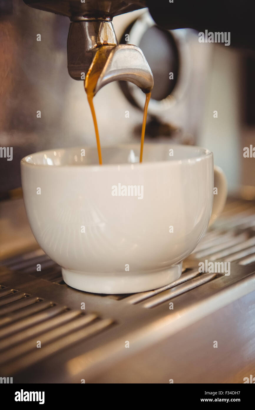 Machine making a cup of coffee Stock Photo - Alamy