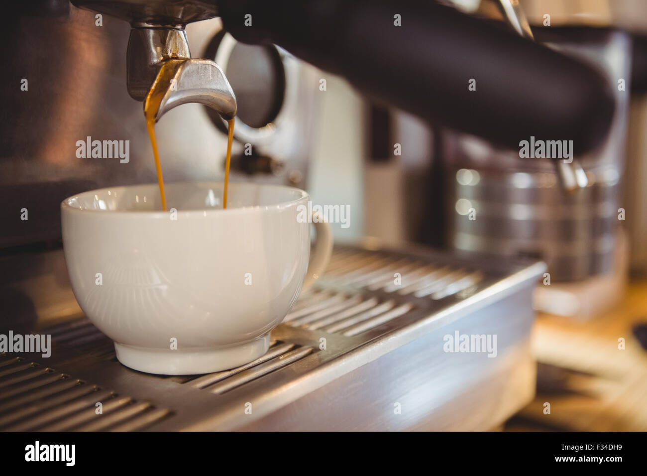 Machine making a cup of coffee Stock Photo - Alamy
