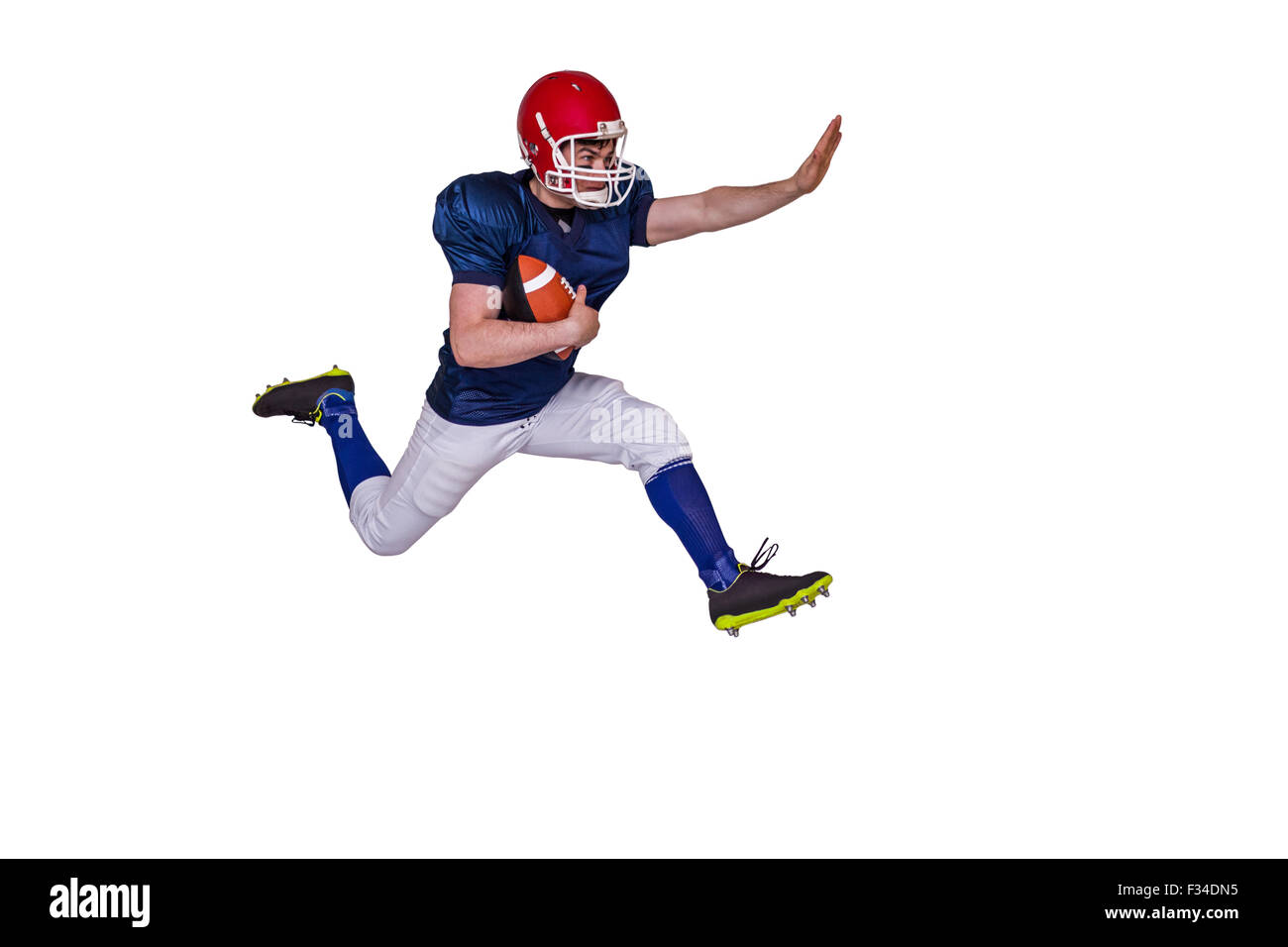 American football player jumping with the ball Stock Photo - Alamy