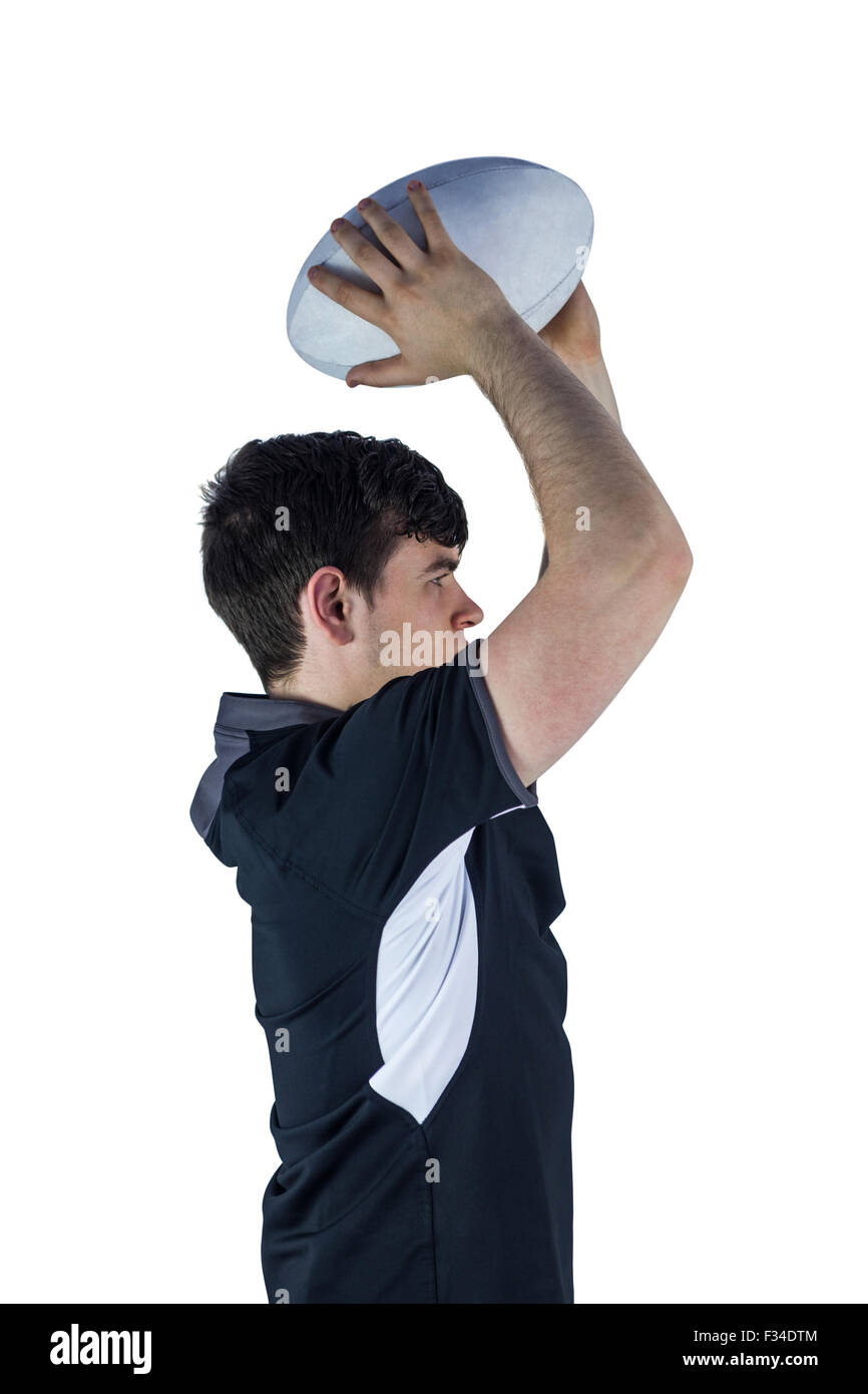 Profile view of rugby player throwing a ball Stock Photo - Alamy
