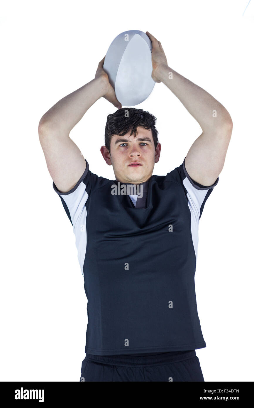 Portrait of a rugby player throwing a ball Stock Photo - Alamy