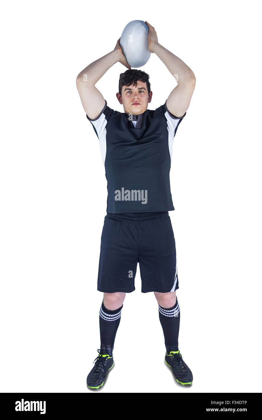 Portrait of a rugby player throwing a ball Stock Photo - Alamy