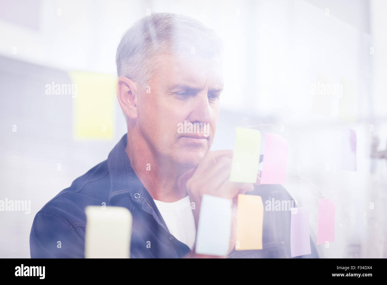 Businessman holding post it hi-res stock photography and images - Alamy