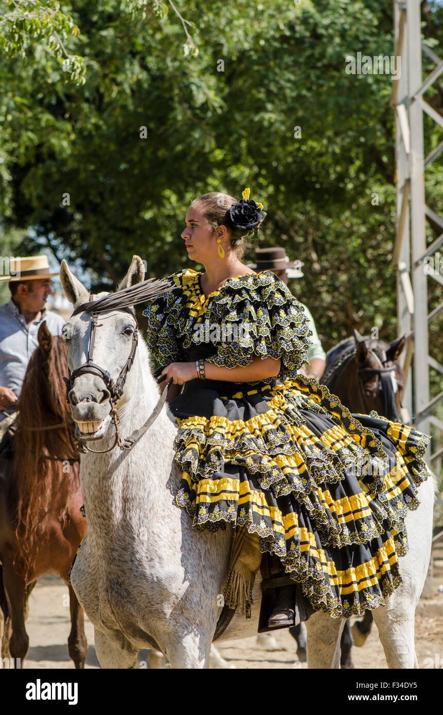 Woman in traditional dress, horseriding, catholic pilgrimage, romeria ...