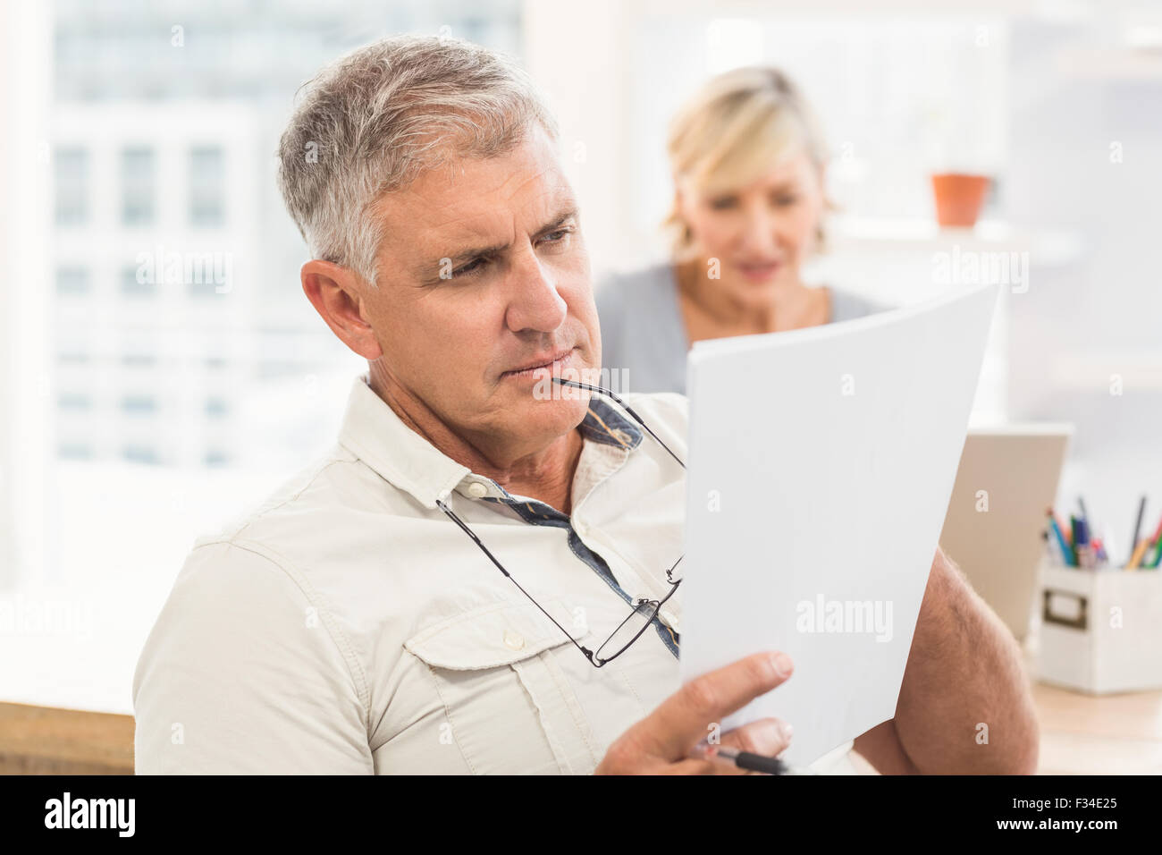 Cool woman reading a paper document hi-res stock photography and images ...