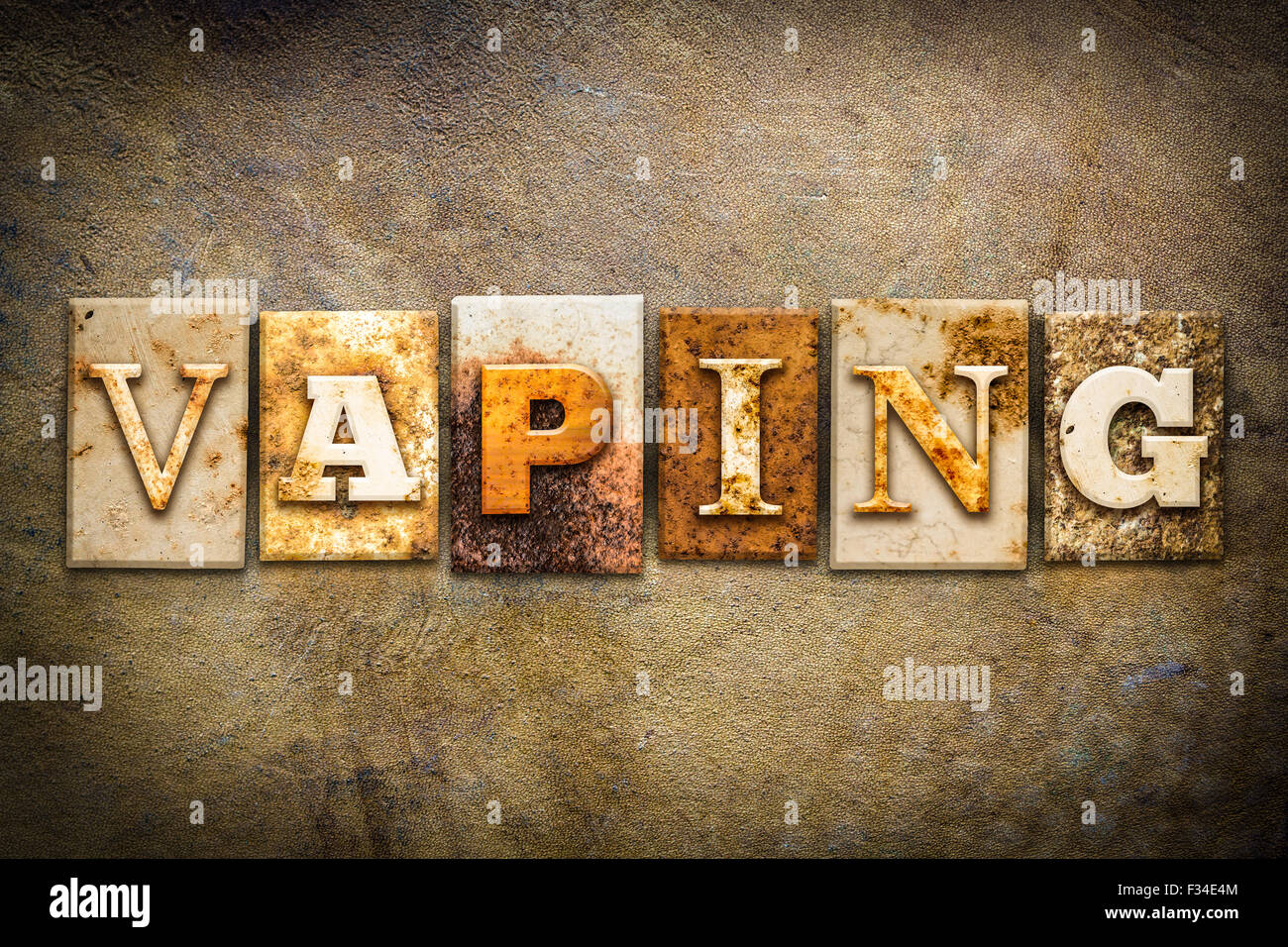 The word "VAPING" written in rusty metal letterpress type on an old ...