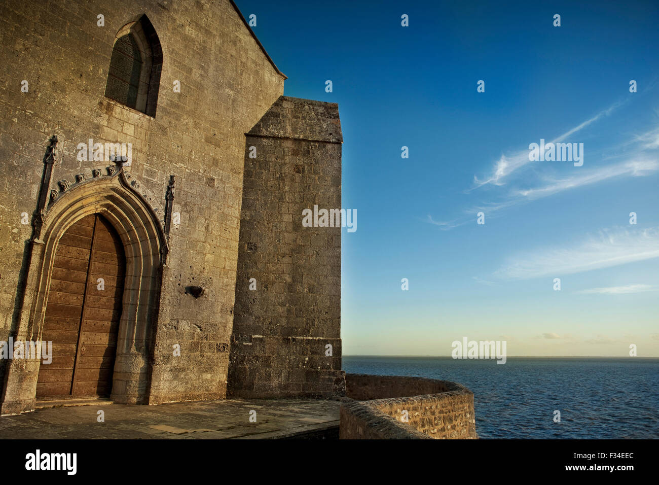 Sunset on a church facing the sea Stock Photo - Alamy