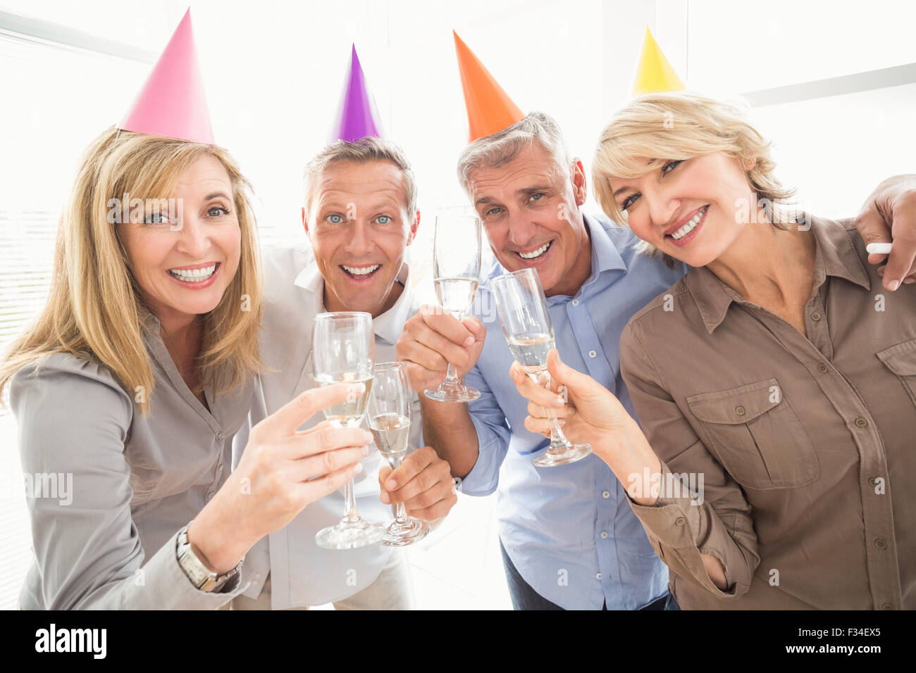 Casual business people making birthday toasts Stock Photo - Alamy