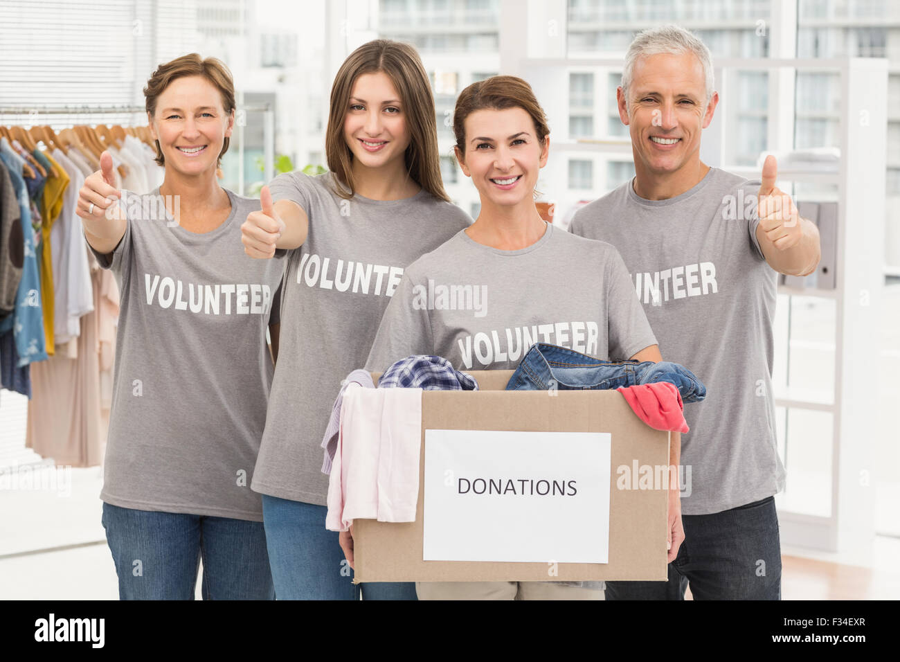 Volunteers people holding up hi-res stock photography and images - Alamy