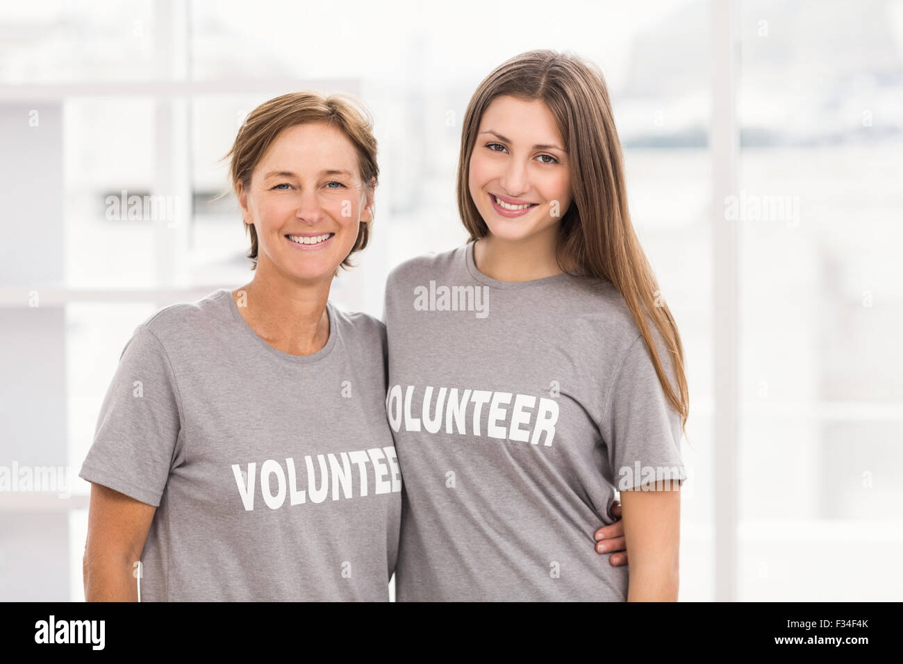 Putting arms around hi-res stock photography and images - Alamy