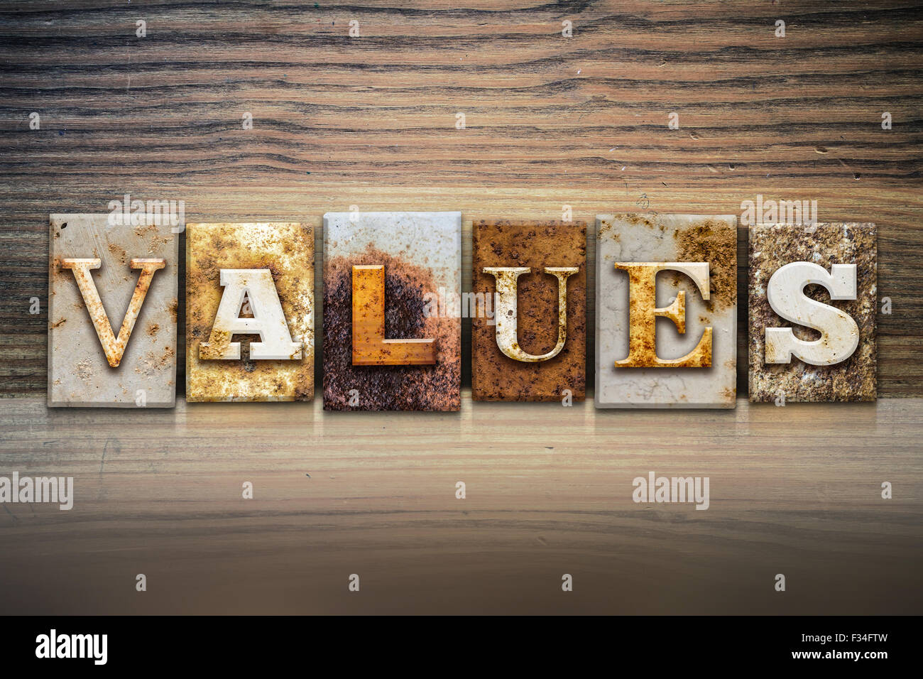 The word "VALUES" written in rusty metal letterpress type sitting on a ...