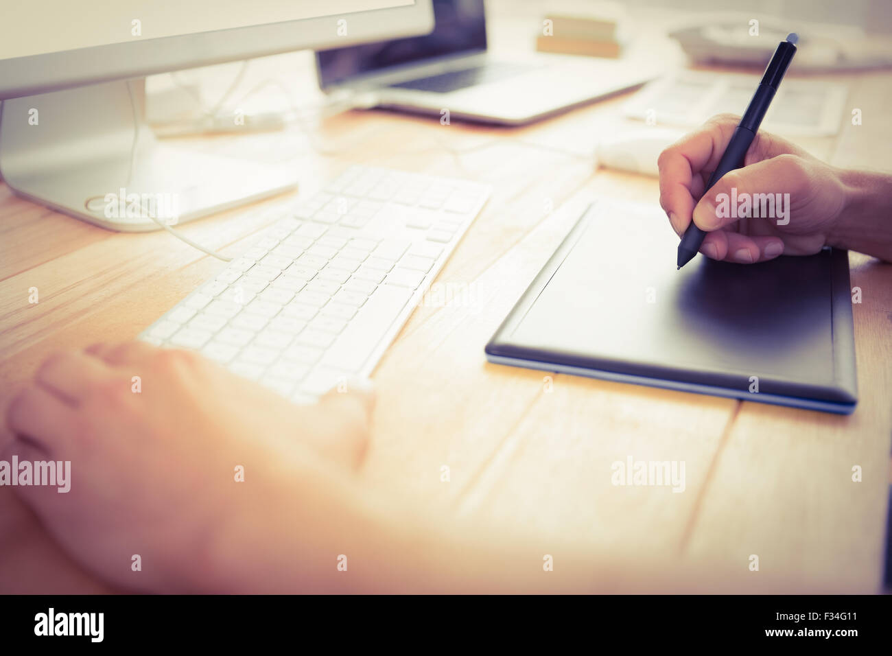 Graphic designer working with digitizer Stock Photo - Alamy