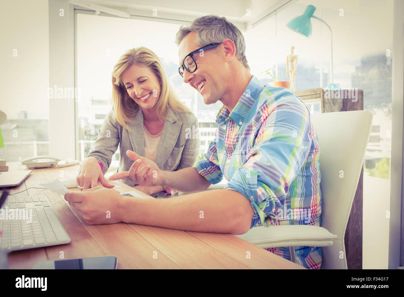 Smiling creative design team working together Stock Photo - Alamy