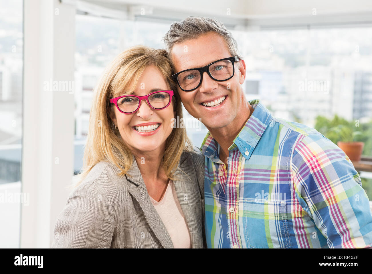 Creative design team smiling at camera Stock Photo - Alamy