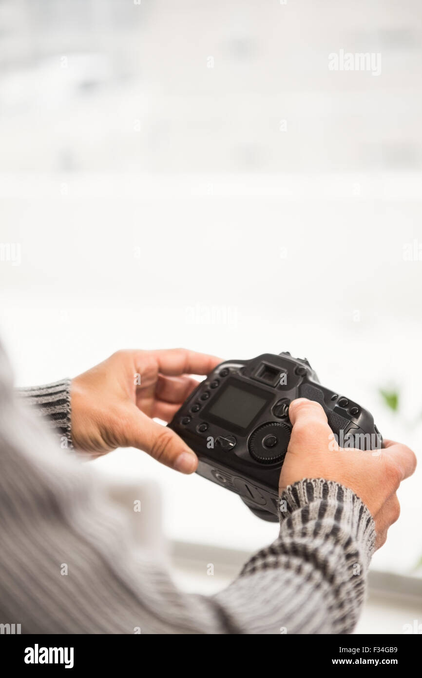 Close up view of hands holding camera Stock Photo - Alamy