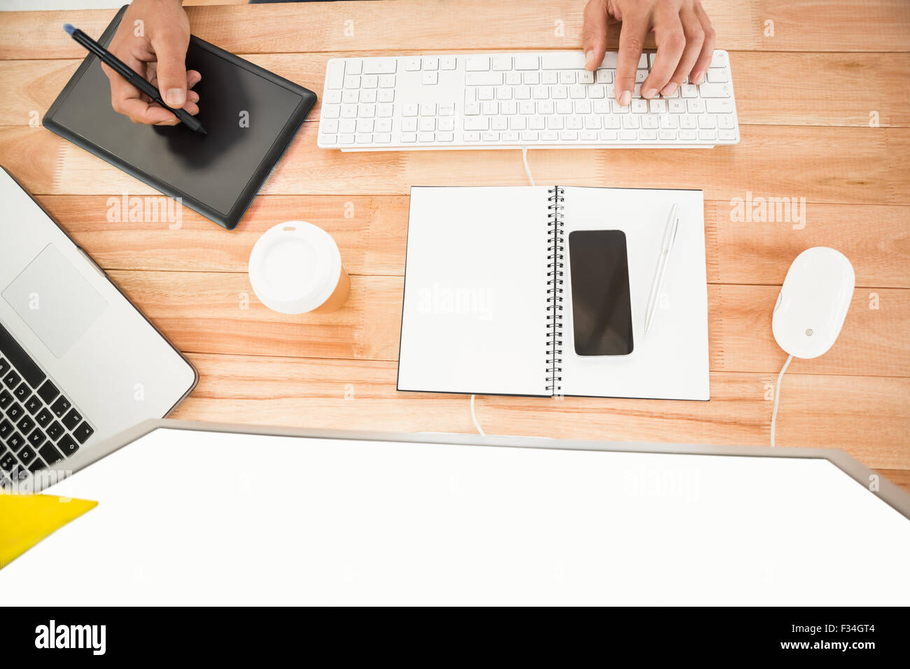 Hands working with computer and digitizer Stock Photo - Alamy