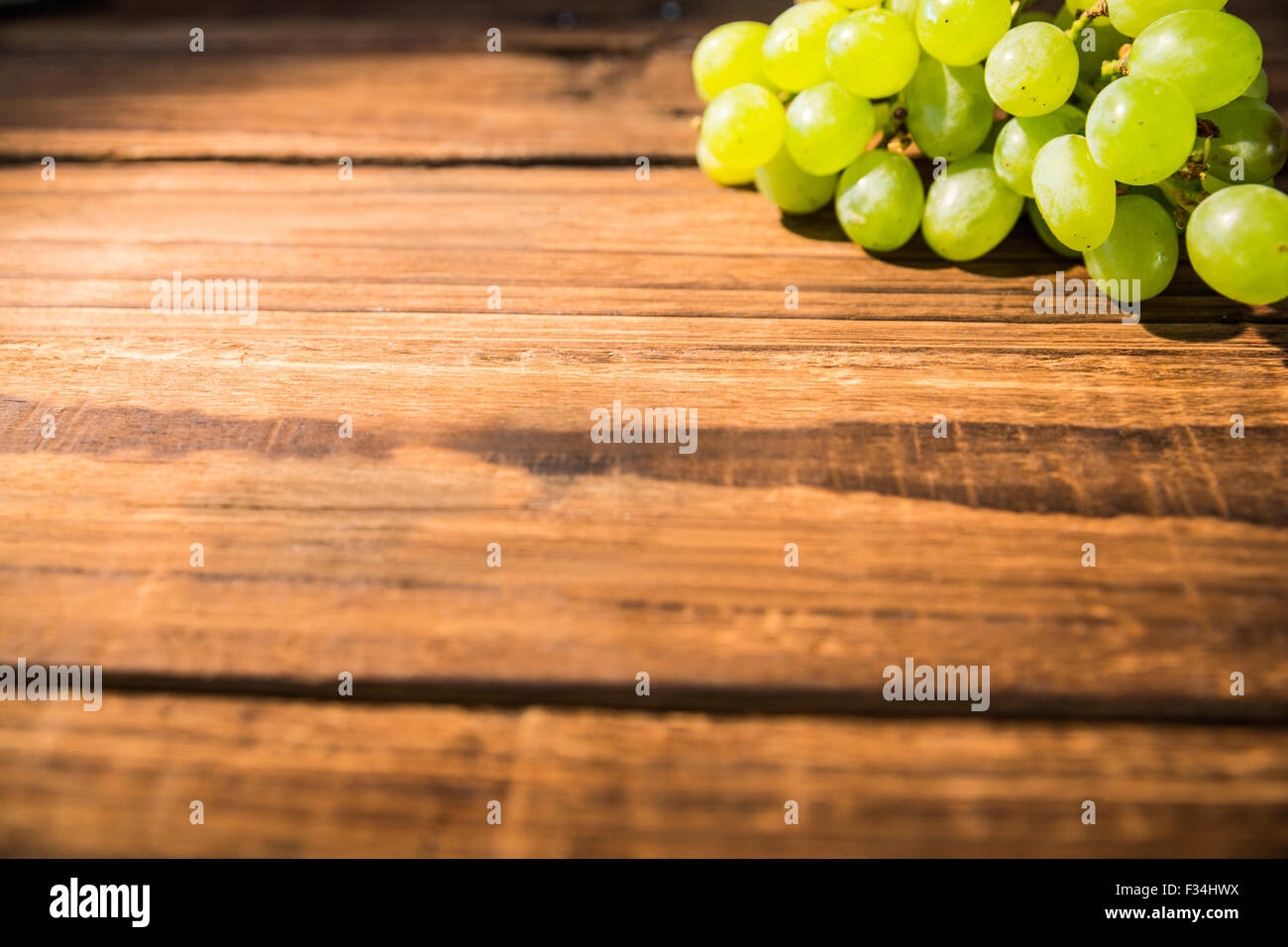 Bunch of grapes on table Stock Photo - Alamy