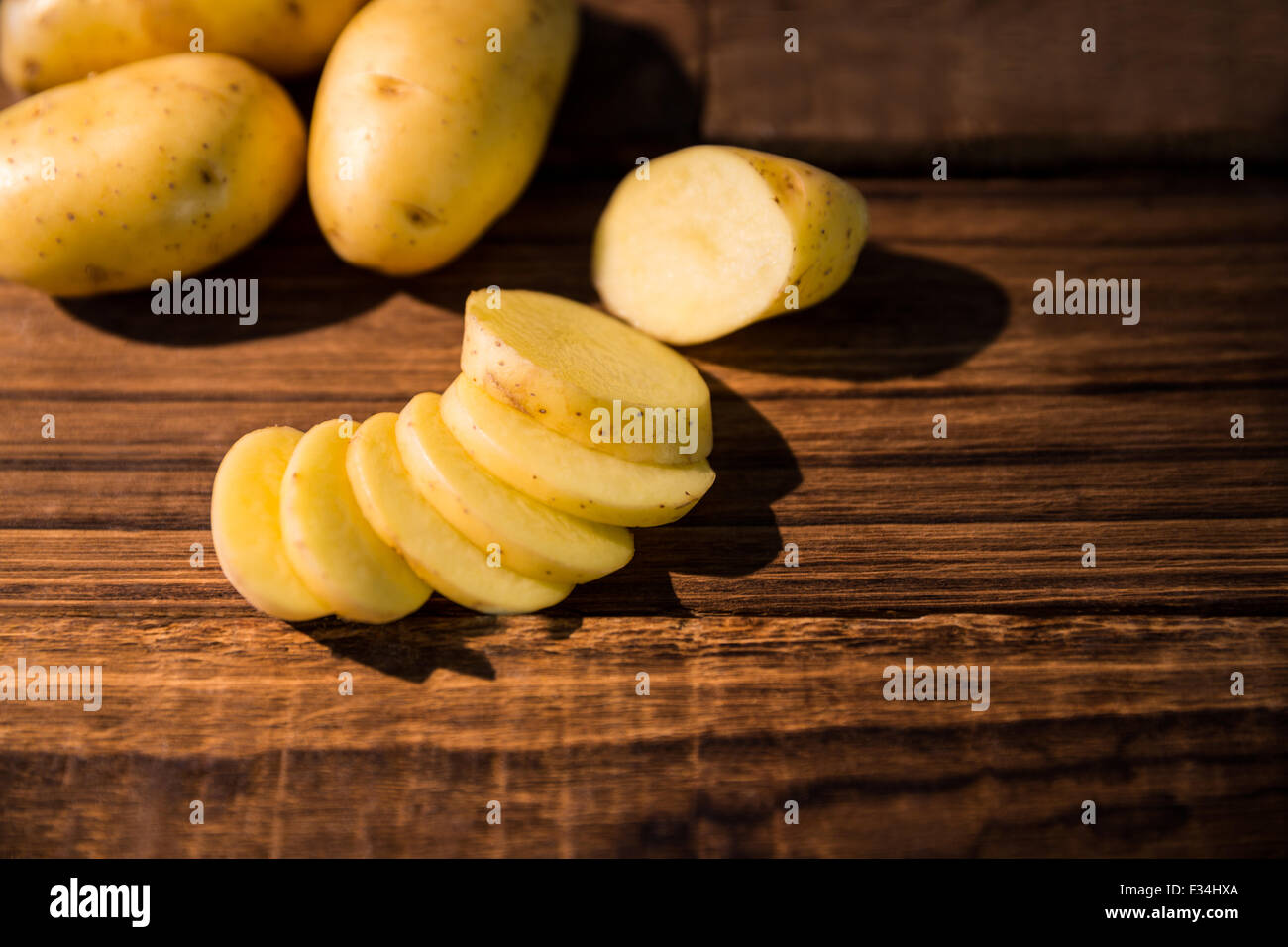 Potato slices on a table Stock Photo - Alamy
