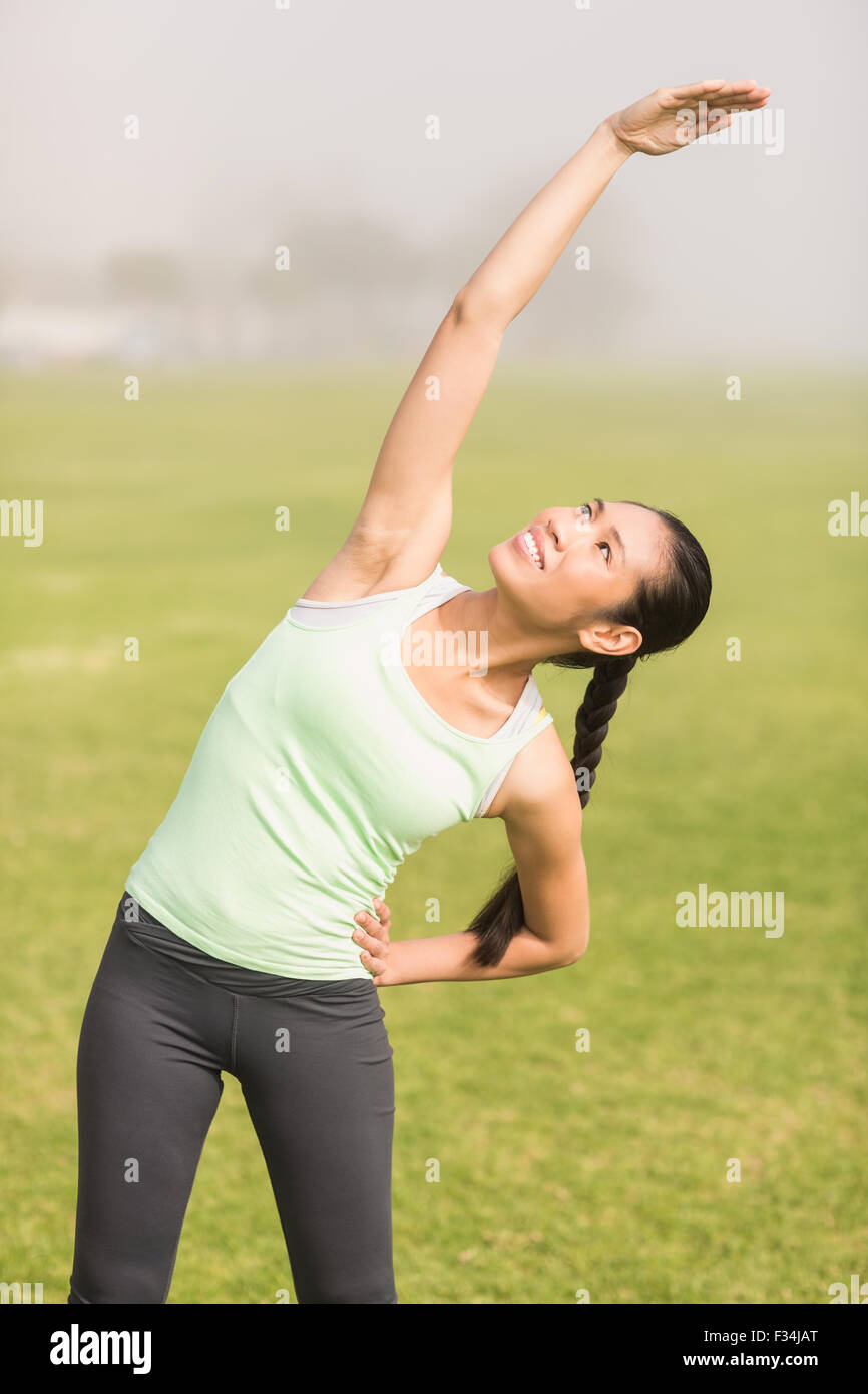 Sporty woman stretching arms Stock Photo - Alamy