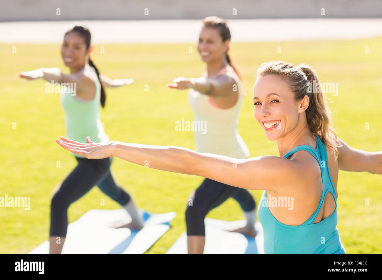 Yoga teacher and sporty women attending yoga class Stock Photo - Alamy