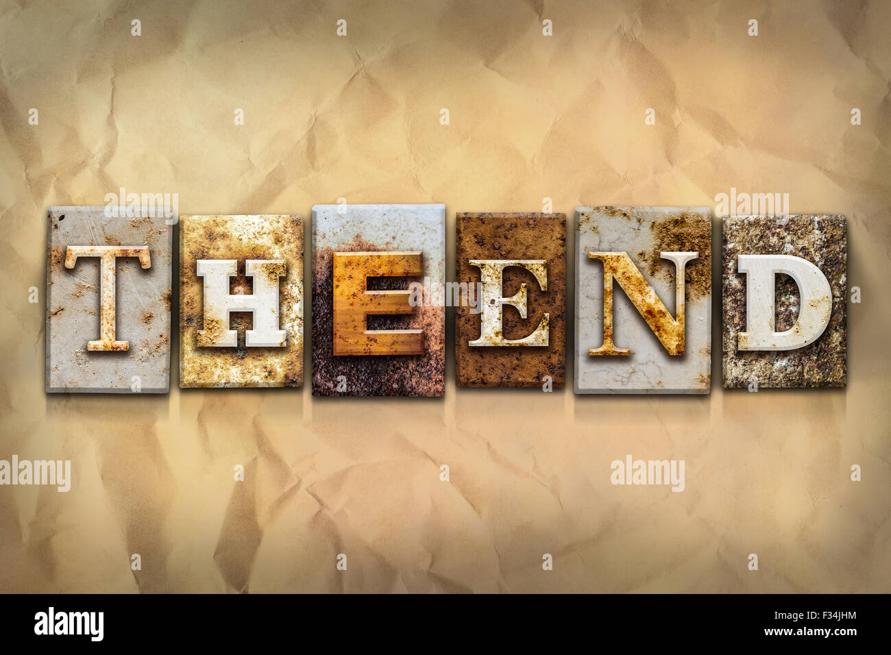 The word "THE END" written in rusty metal letterpress type on a ...