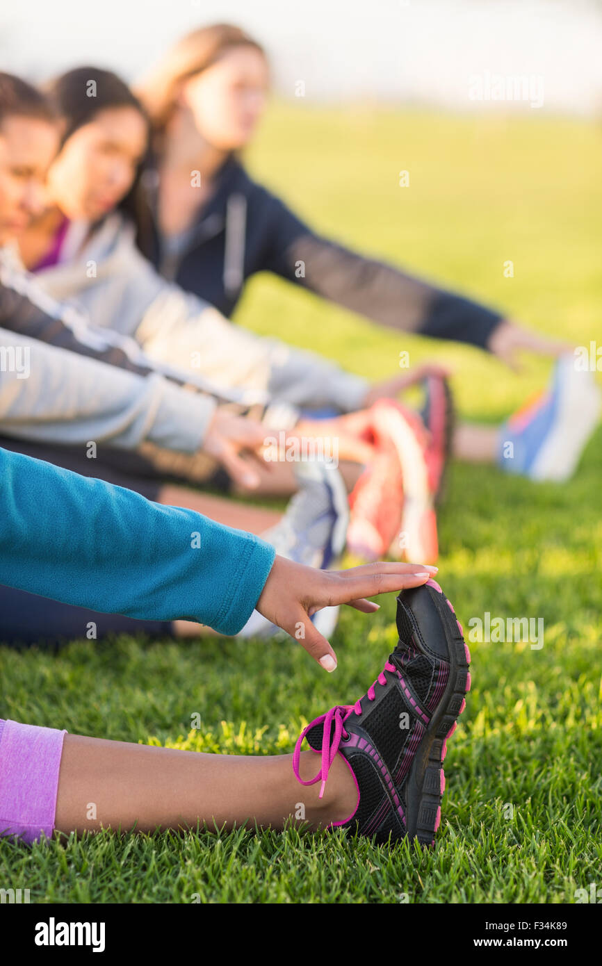 Sporty women stretching during fitness class Stock Photo - Alamy