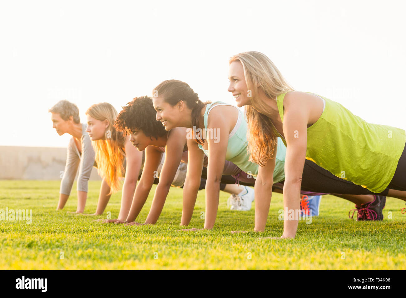 Sporty women doing push ups during fitness class Stock Photo - Alamy