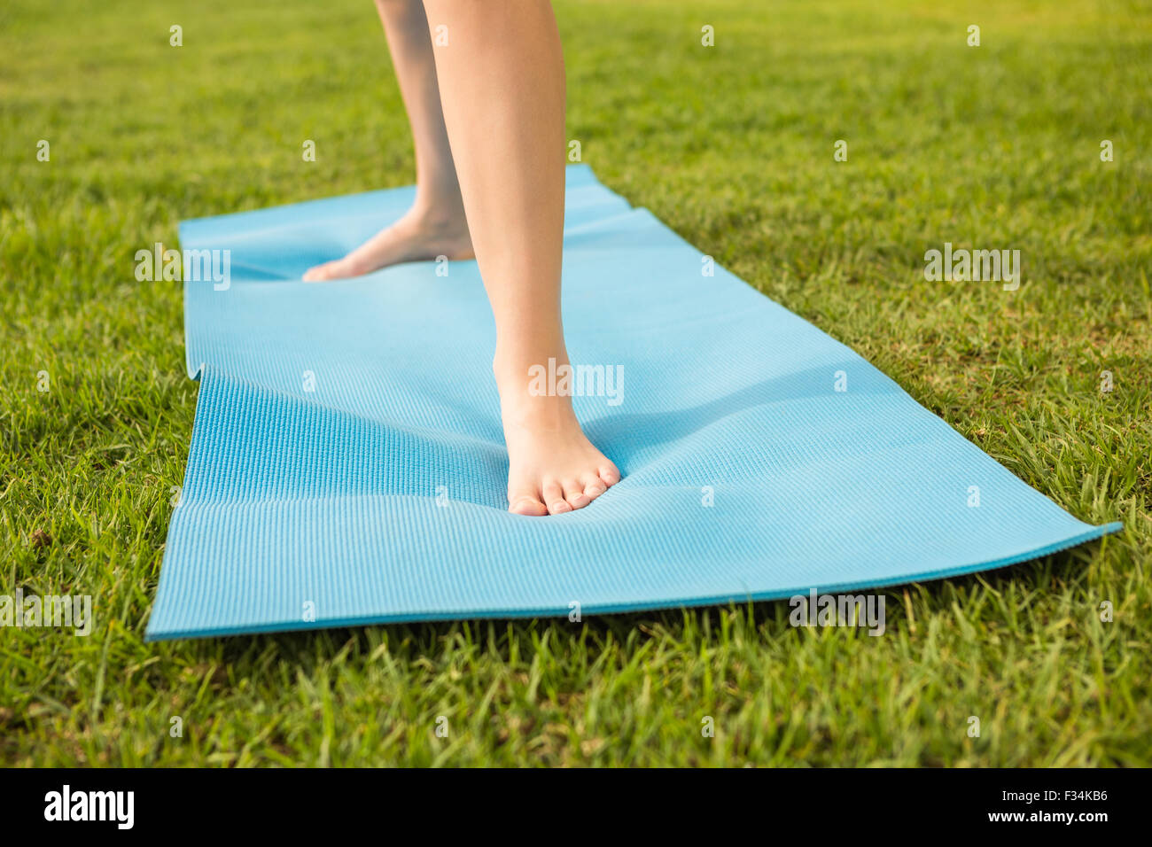 Feet standing on exercise mat Stock Photo - Alamy