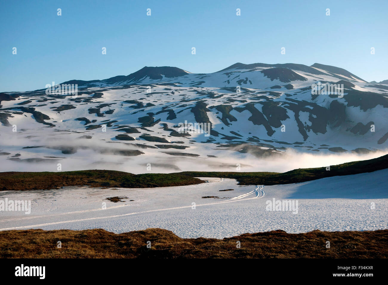 Snowy slopes of Gorely volcano, Kamchatka Peninsula, Russia Stock Photo ...