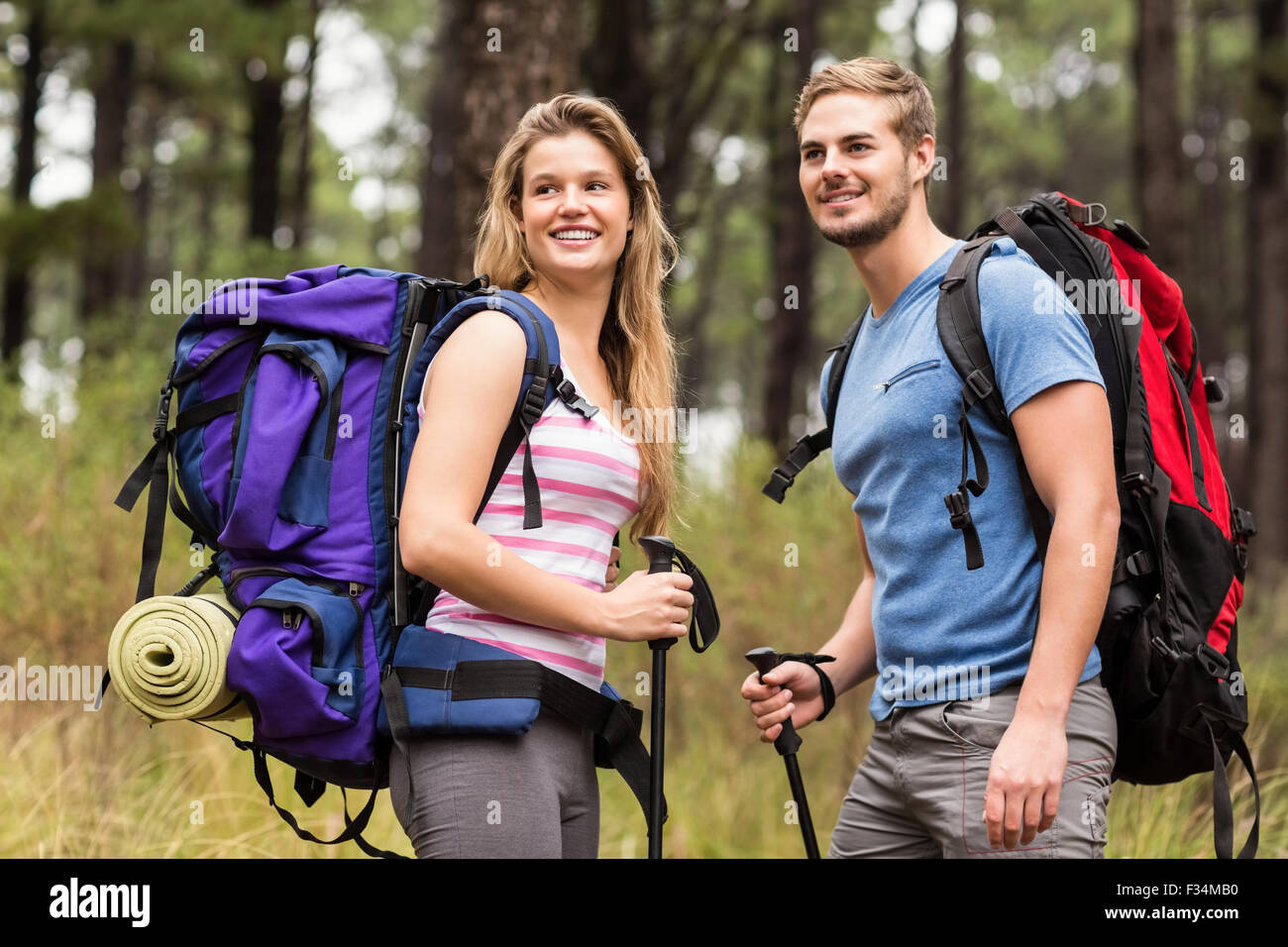 Young happy hikers looking in the distance Stock Photo - Alamy