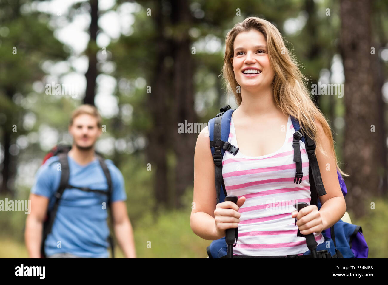 Pretty young hiker with friend Stock Photo - Alamy