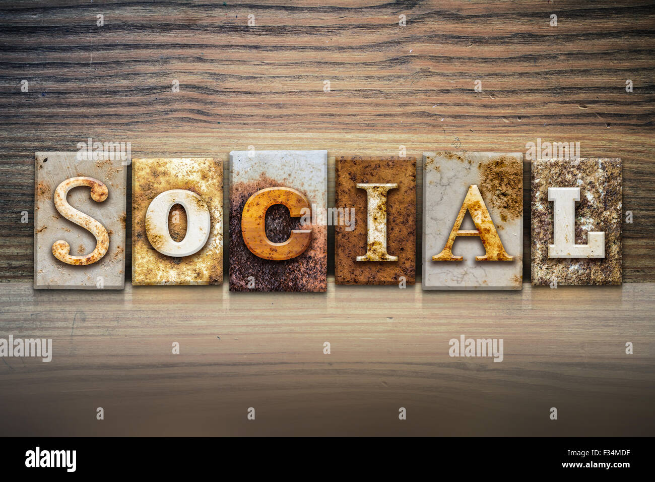 The word "SOCIAL" written in rusty metal letterpress type sitting on a ...