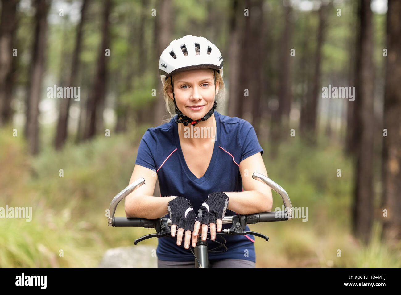 Young pretty happy biker looking at camera Stock Photo - Alamy