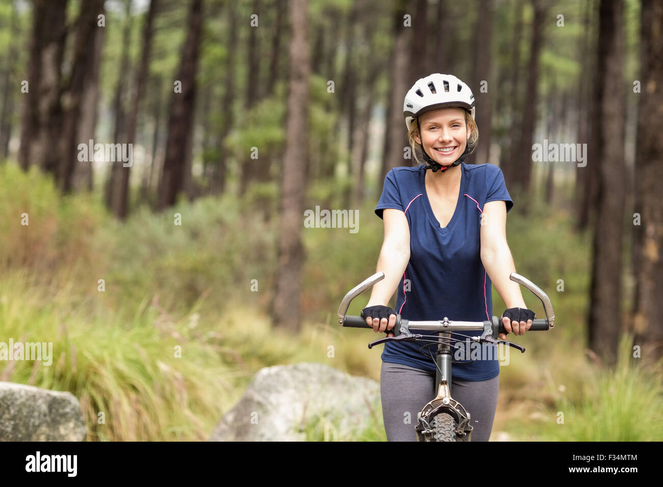 Young pretty happy biker looking at camera Stock Photo - Alamy