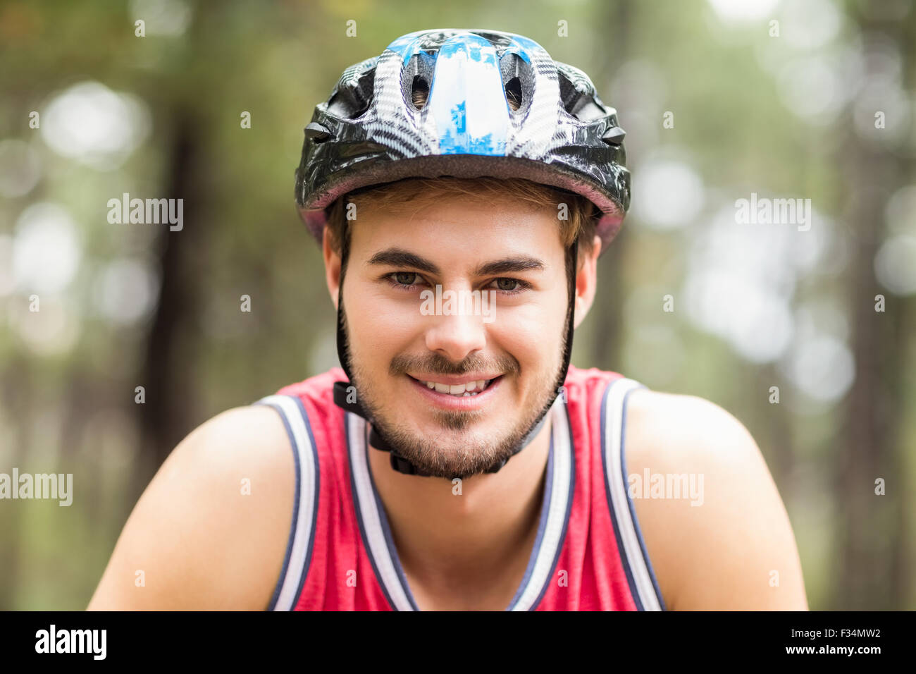 Handsome young biker looking at camera Stock Photo - Alamy